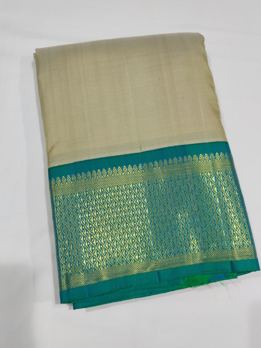 "Pure Cream Kanjivaram Silk Dhoti with Rama Green & Gold Zari Border